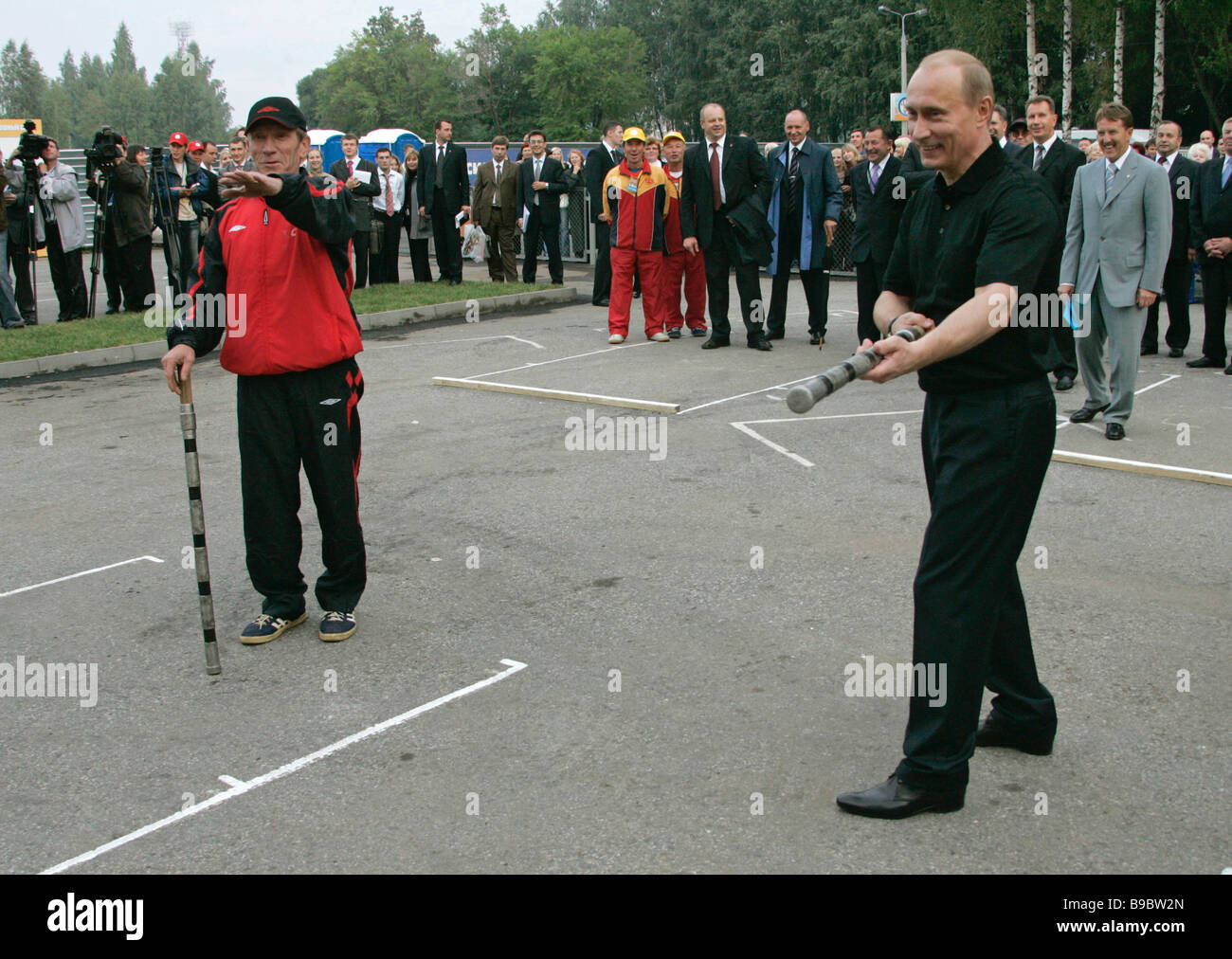 Russian President Vladimir Putin right playing a game of gorodki at the ...