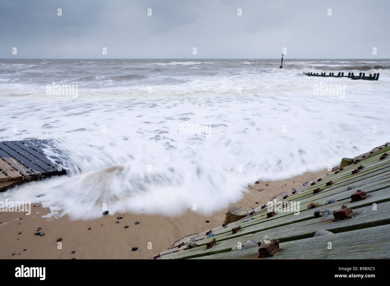 Walcott beach with rough sea and snow clouds approaching the north ...