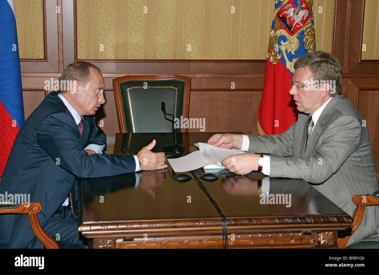President Vladimir Putin and Finance Minister Alexei Kudrin left to ...