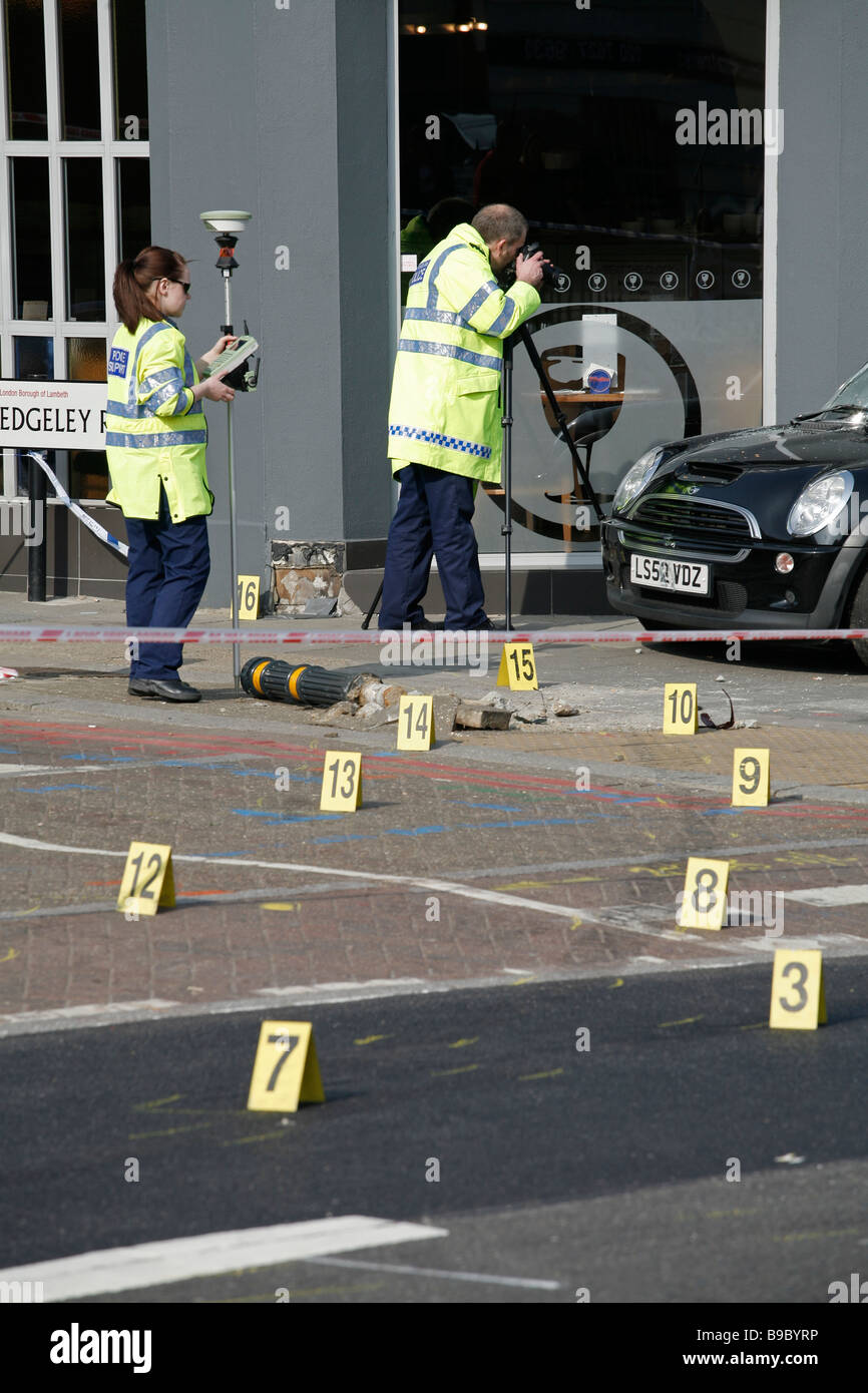 Forensic police take evidence after a road traffic accident leaves a ...