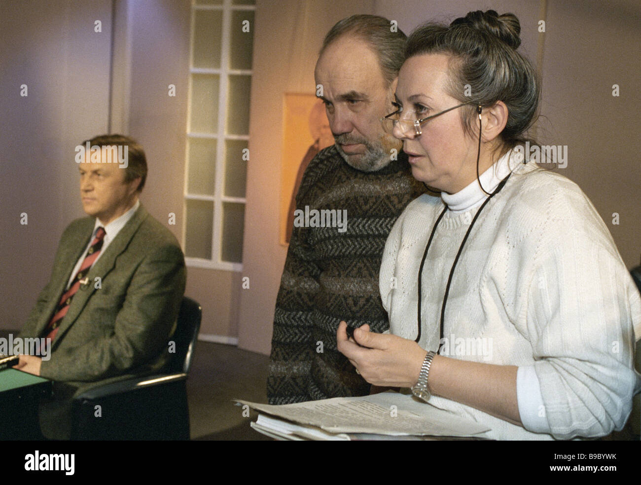 TV host Alexander Krutov left cameraman Igor Ignatov centre and producer Yelena Pozdnyak right ...