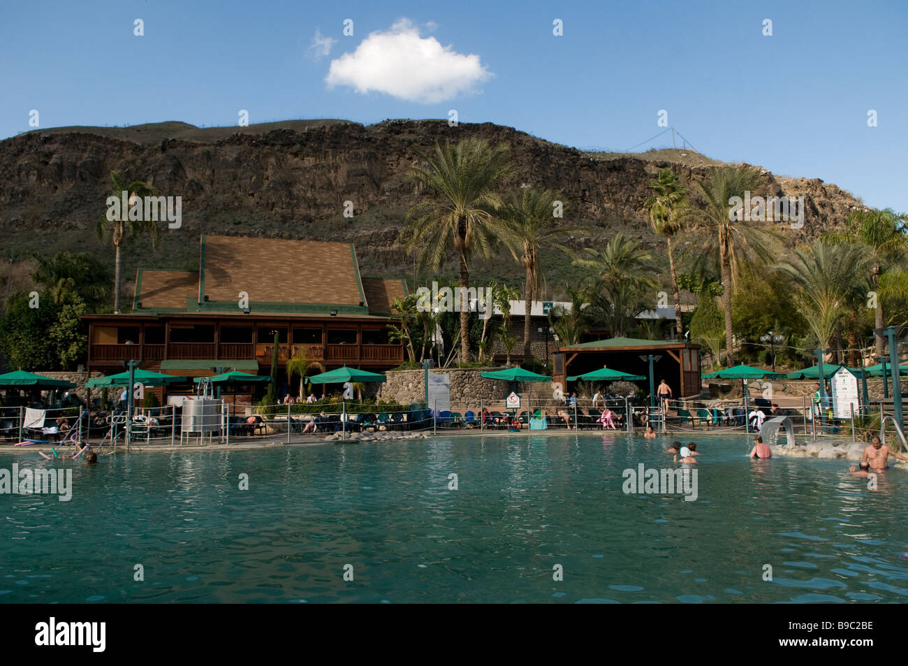 People bath in a pool in Hamat Gader or al-Hamma a hot springs site in the Yarmouk River valley ...