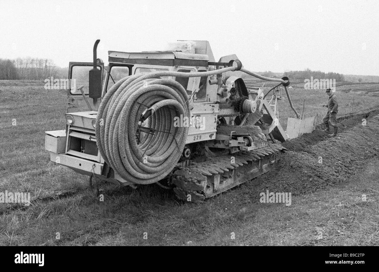 Multi bucket chain trench excavator in operation Stock Photo - Alamy
