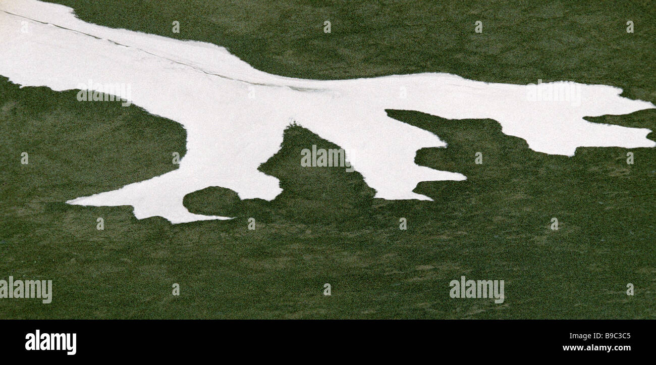 The unmelted snow in summer tundra Stock Photo - Alamy