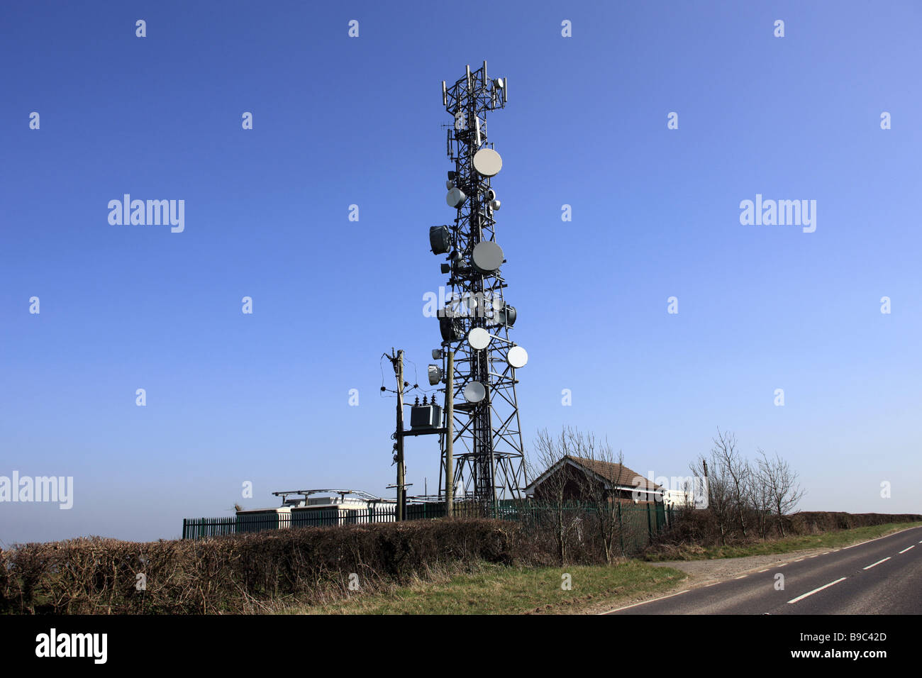 Tele communications mast with numerous Satellite dishes bolted onto the ...
