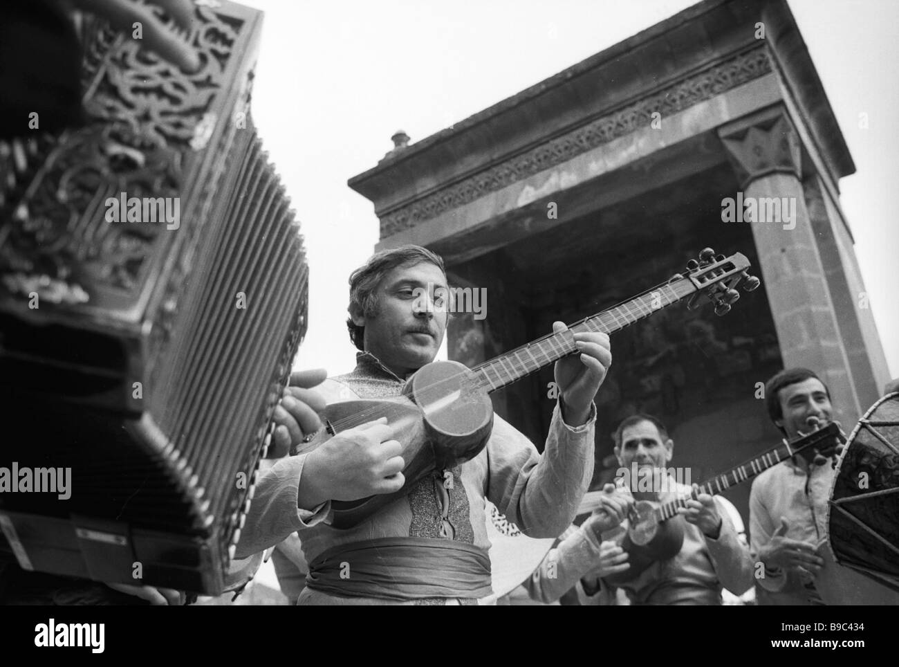 Amateur performers playing the tar old Azeri folk string instrument ...