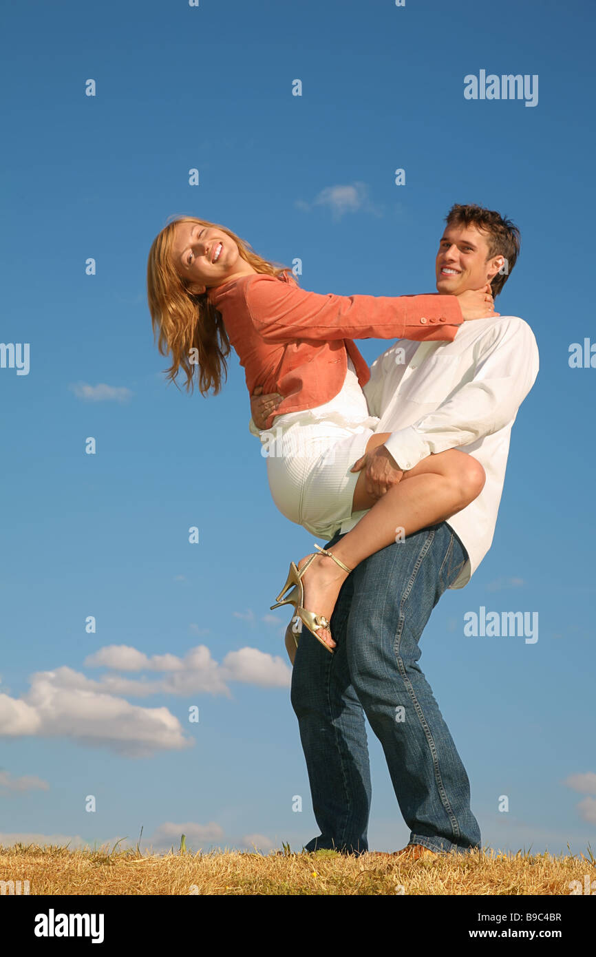 Man holds young girl at his hands Stock Photo - Alamy
