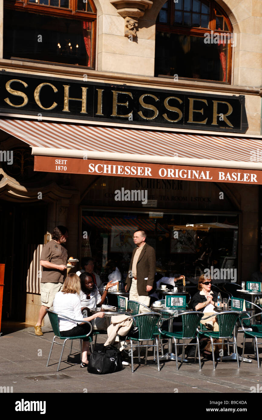 Guests sitting in pavement cafe at market square Old Town Basel Canton ...