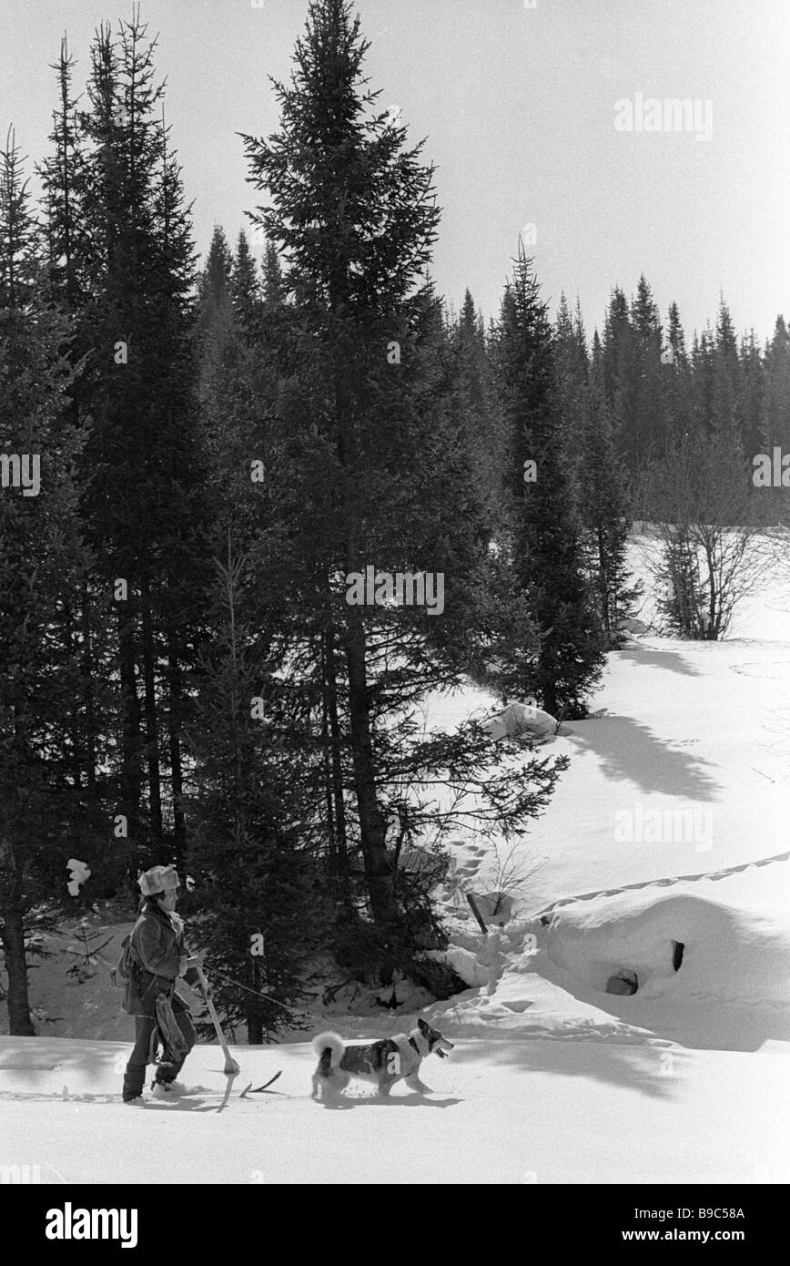 A hunter with his dog in a forest in Gornaya Shoriya Stock Photo - Alamy