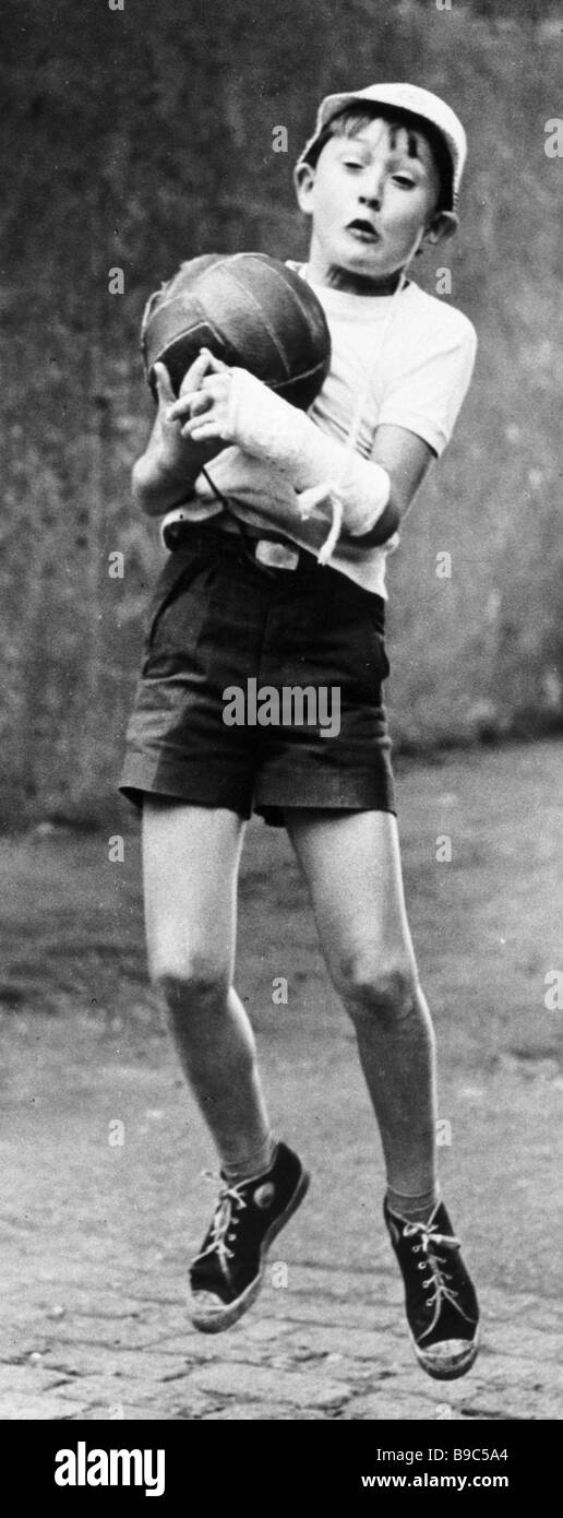 A goalkeeper boy receiving the ball Stock Photo - Alamy