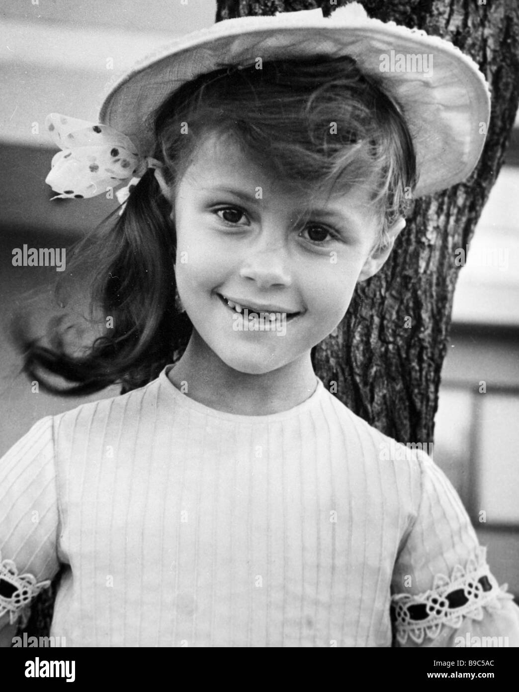 A girl in a smart hat Stock Photo - Alamy