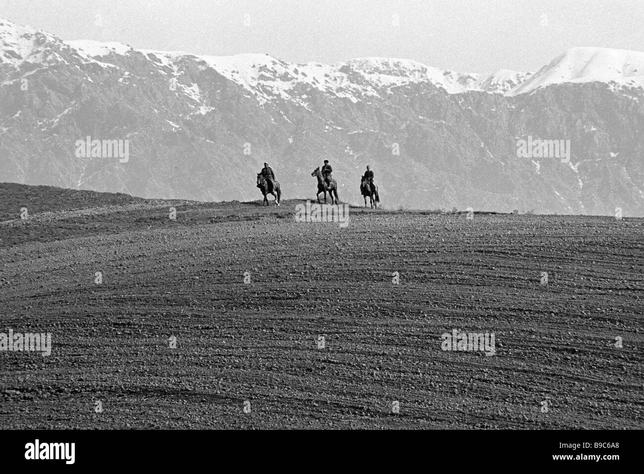 Horsemen in foothills of the Gissar range Stock Photo - Alamy