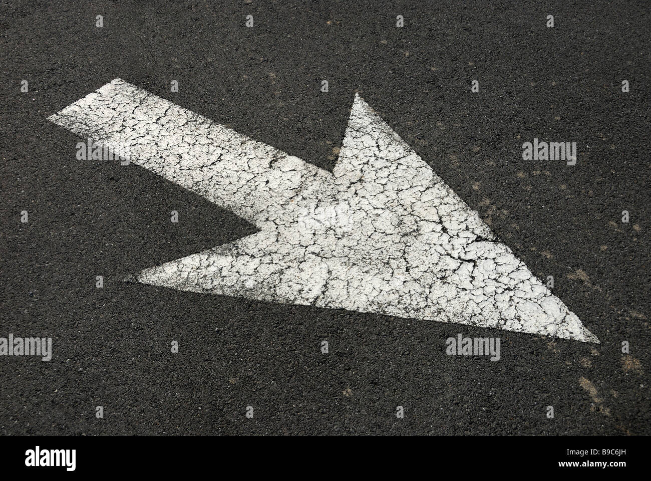 Arrow on pavement Stock Photo - Alamy