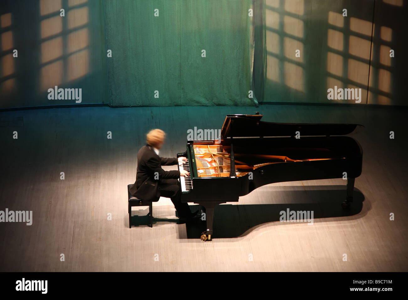 pianist after the piano on the scene Stock Photo - Alamy