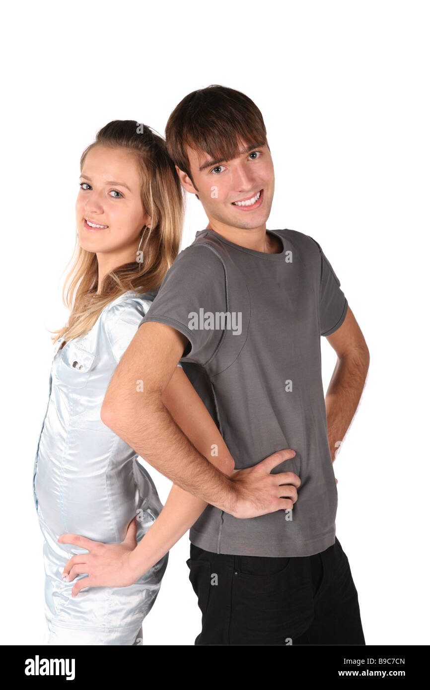 teenager couple stand back to back on white Stock Photo - Alamy