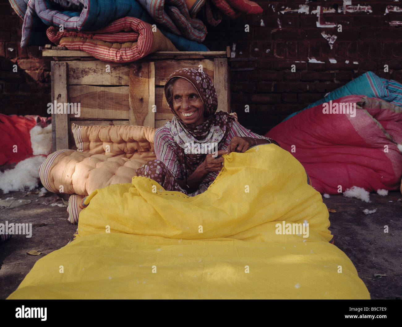 Indian lady in yellow hi-res stock photography and images - Alamy