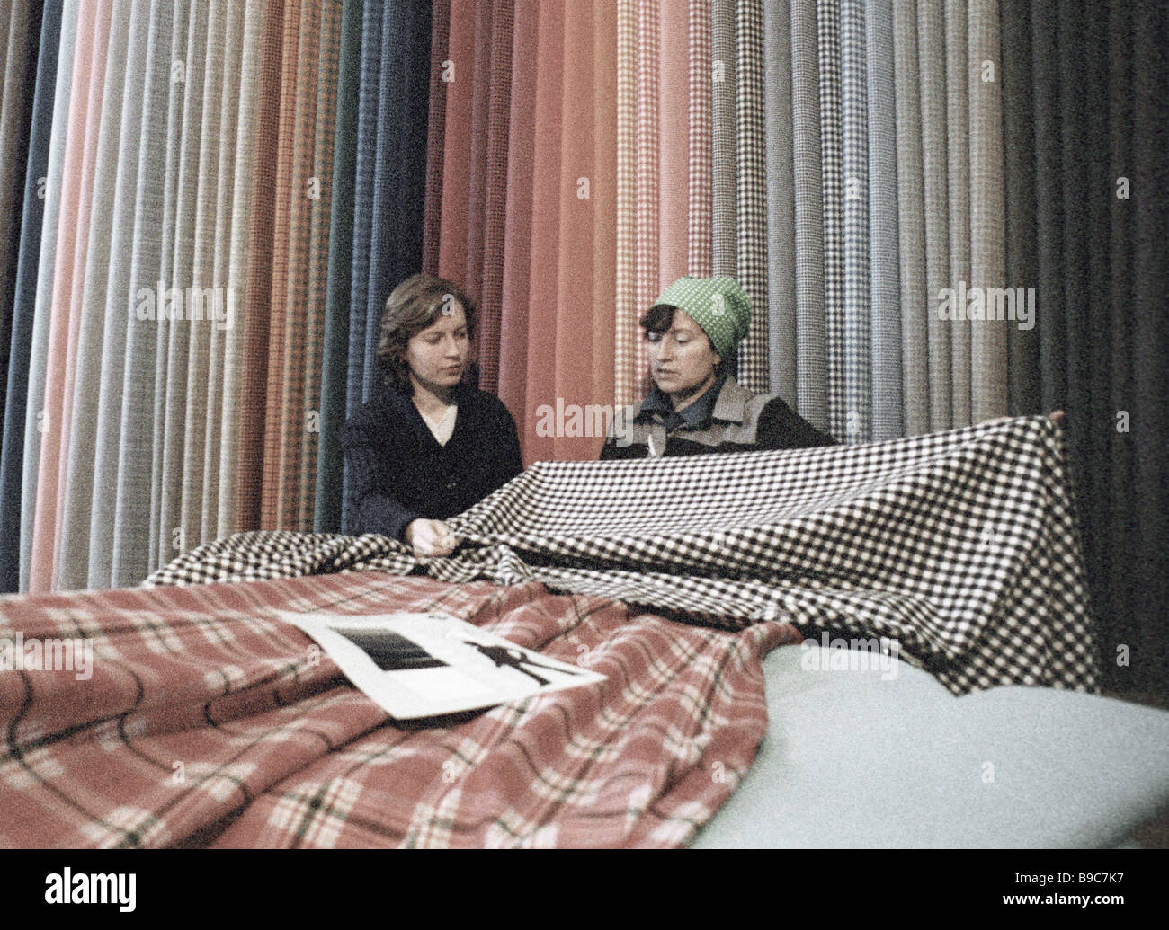 Artist showing new fabric samples to the Minsk worsted mill s weaver ...