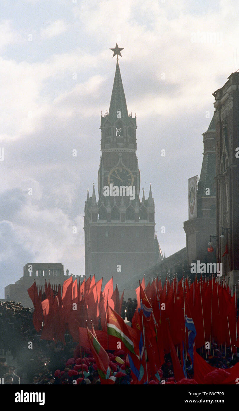 Demonstrators with flags marching in Red Square Celebrations of the ...