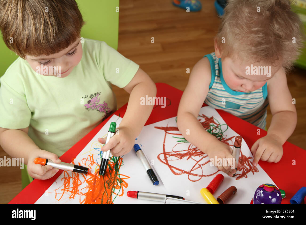 two children drawing Stock Photo - Alamy
