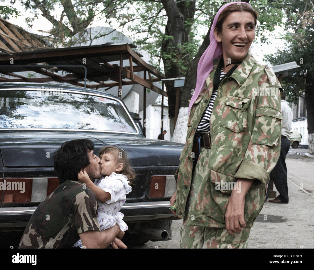 A young Chechen family near a car Stock Photo - Alamy