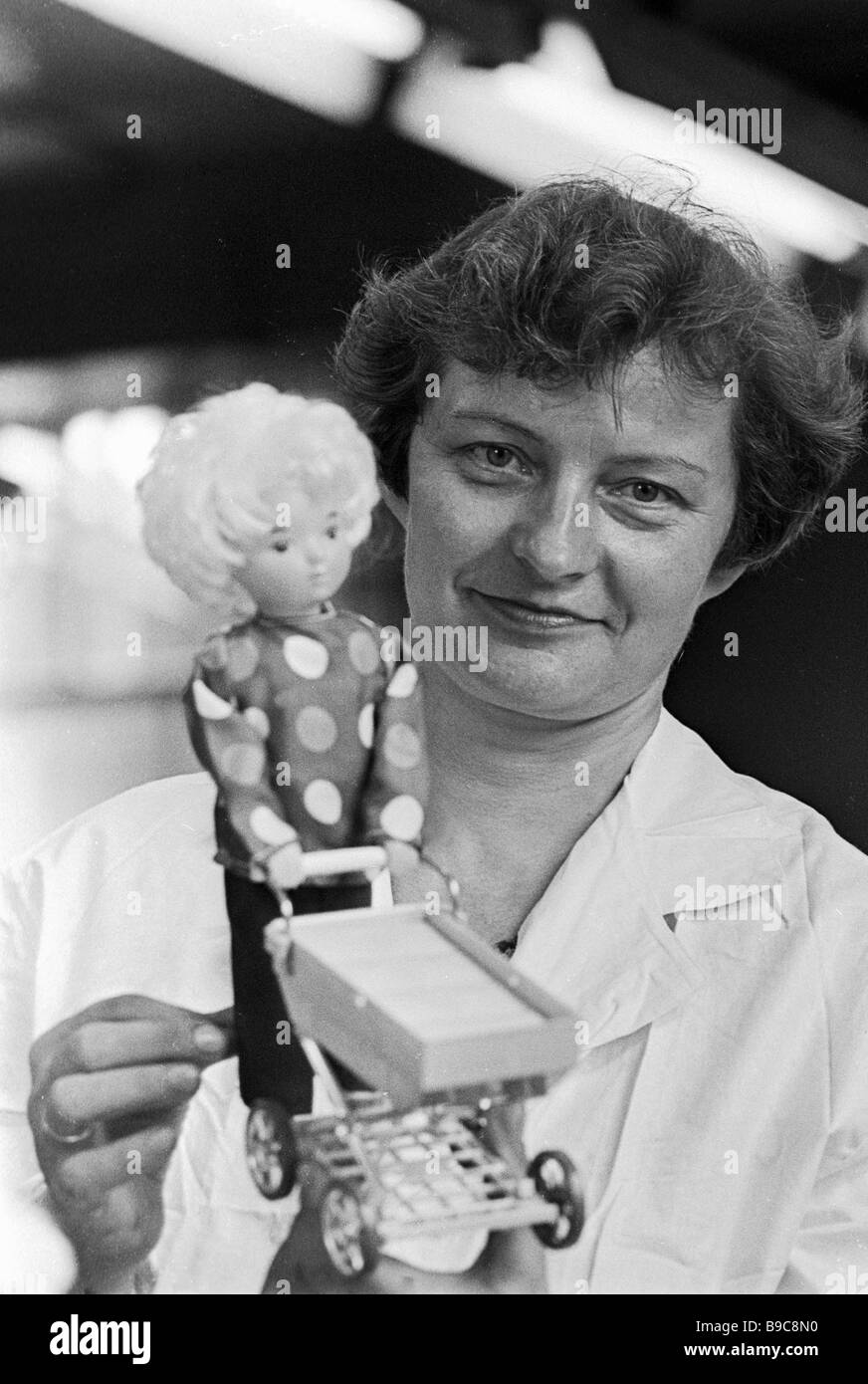 A worker of the Riga Straume Toy Factory with a new toy Stock Photo - Alamy