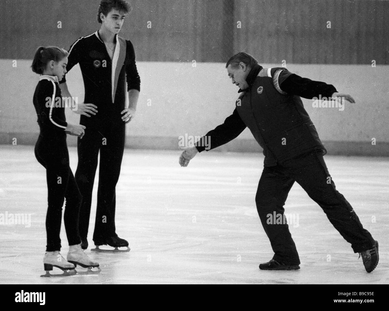 Coach Stanislav Zhuk right and his students Sergei Grinkov and ...