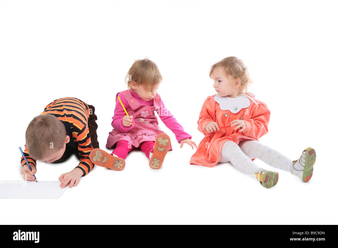 Three children drawing Stock Photo - Alamy