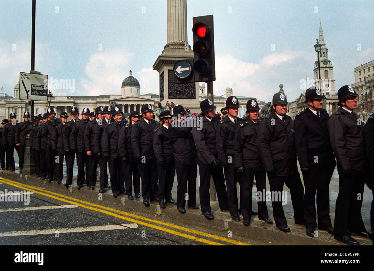 UK police form a line in front of Nelsons column in Trafalgar square in ...