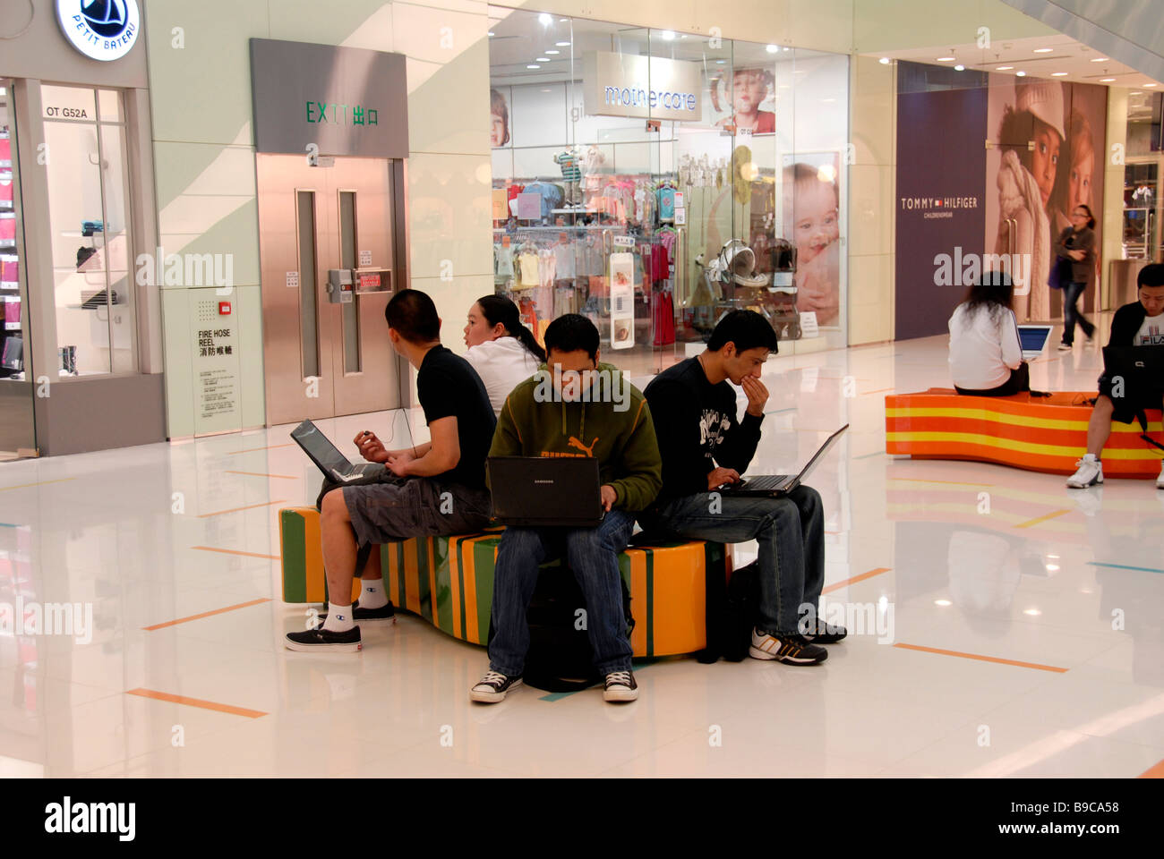 Young people connecting internet, Harbor city ocean terminal, Kowloon ...