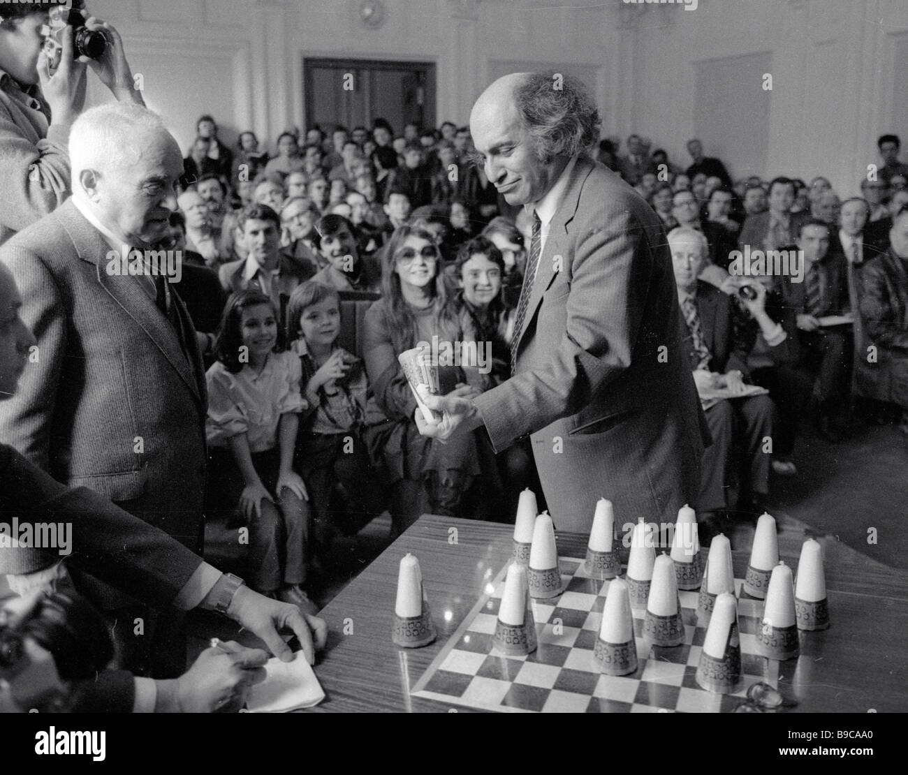 Ex world champion Grand Master Mikhail Tahl standing right showing a ...