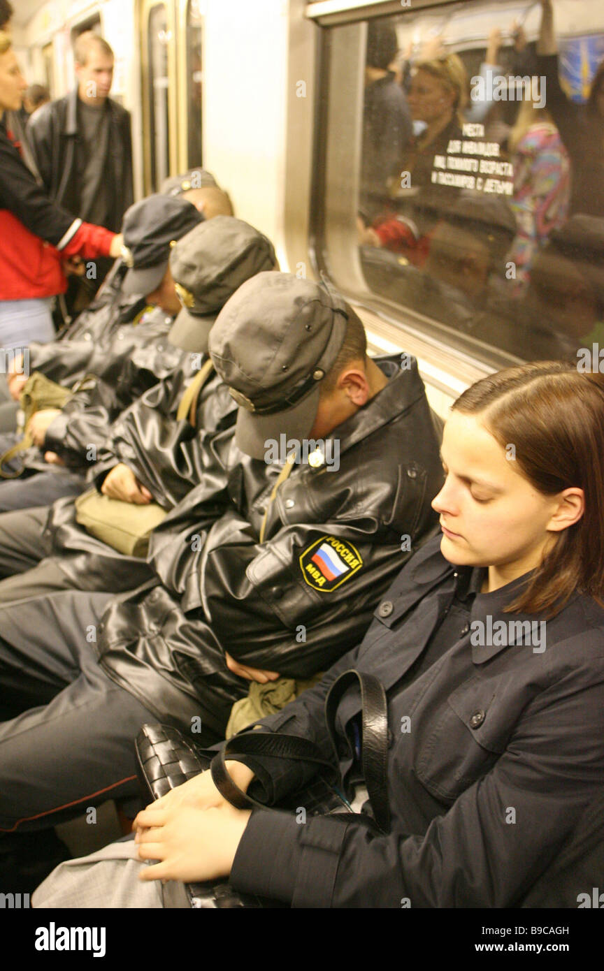 Dozing policemen in the Moscow metro Stock Photo - Alamy