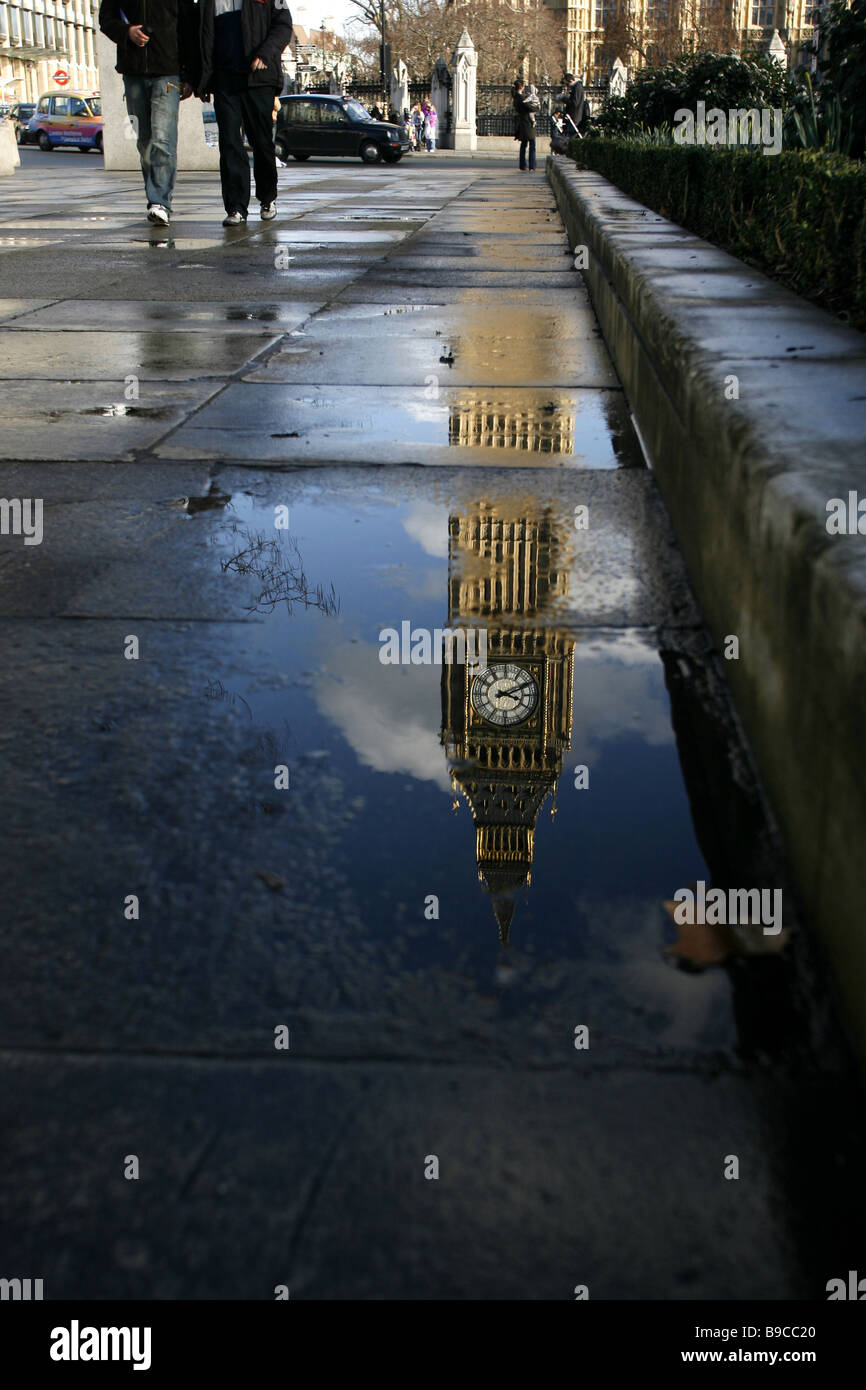 Big Ben or St. Stephen's Tower is reflacted in a puddle at Parliament ...