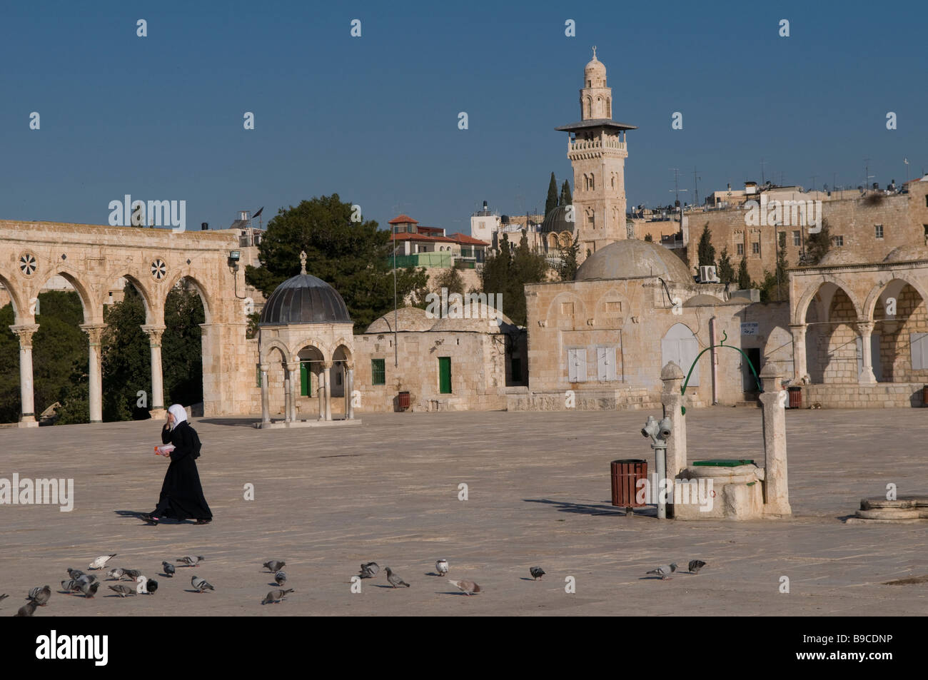 A Palestinian woman walks at the platform of Dome of the Rock in the ...