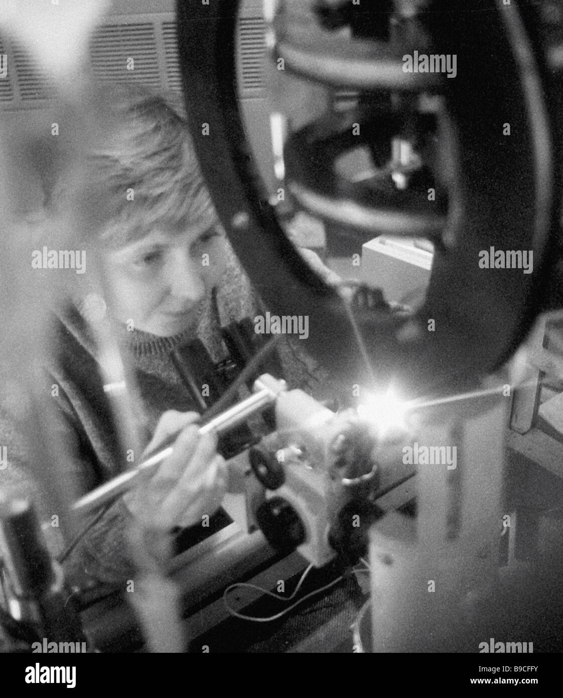 An employee of the Joint Nuclear Research Institute examines the ...