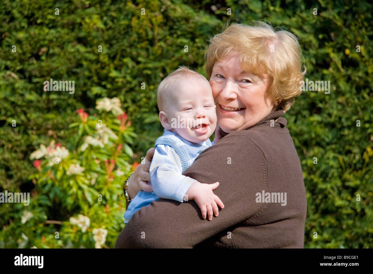 Baby hugging grandma hi-res stock photography and images - Alamy