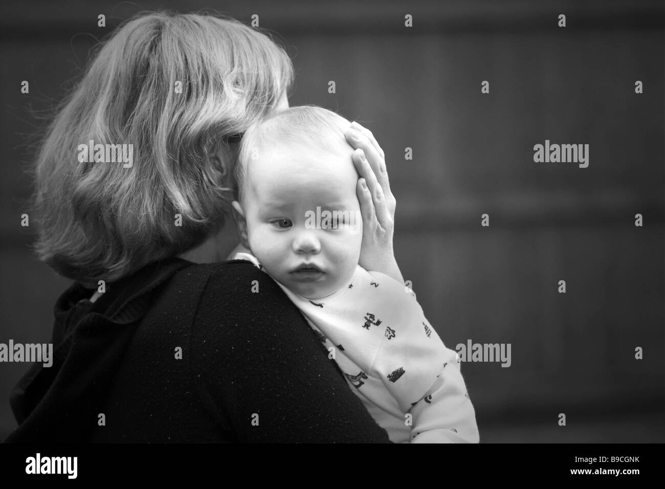 Qust Sad Mom And Baby Sad Mom With Baby Black And White Stock Photos