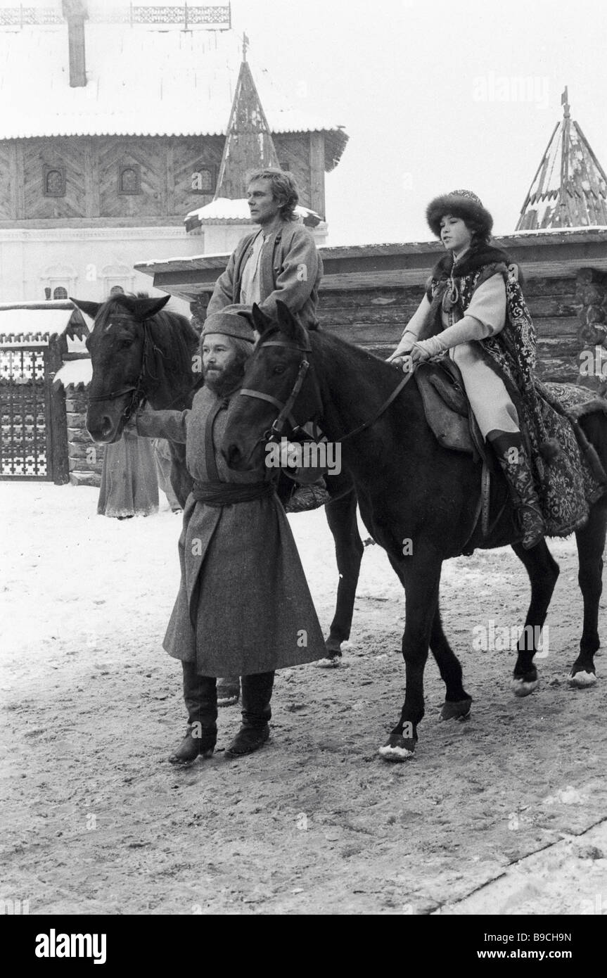 Actors Graham McGrath right and Helmut Griem left riding a horse at the ...