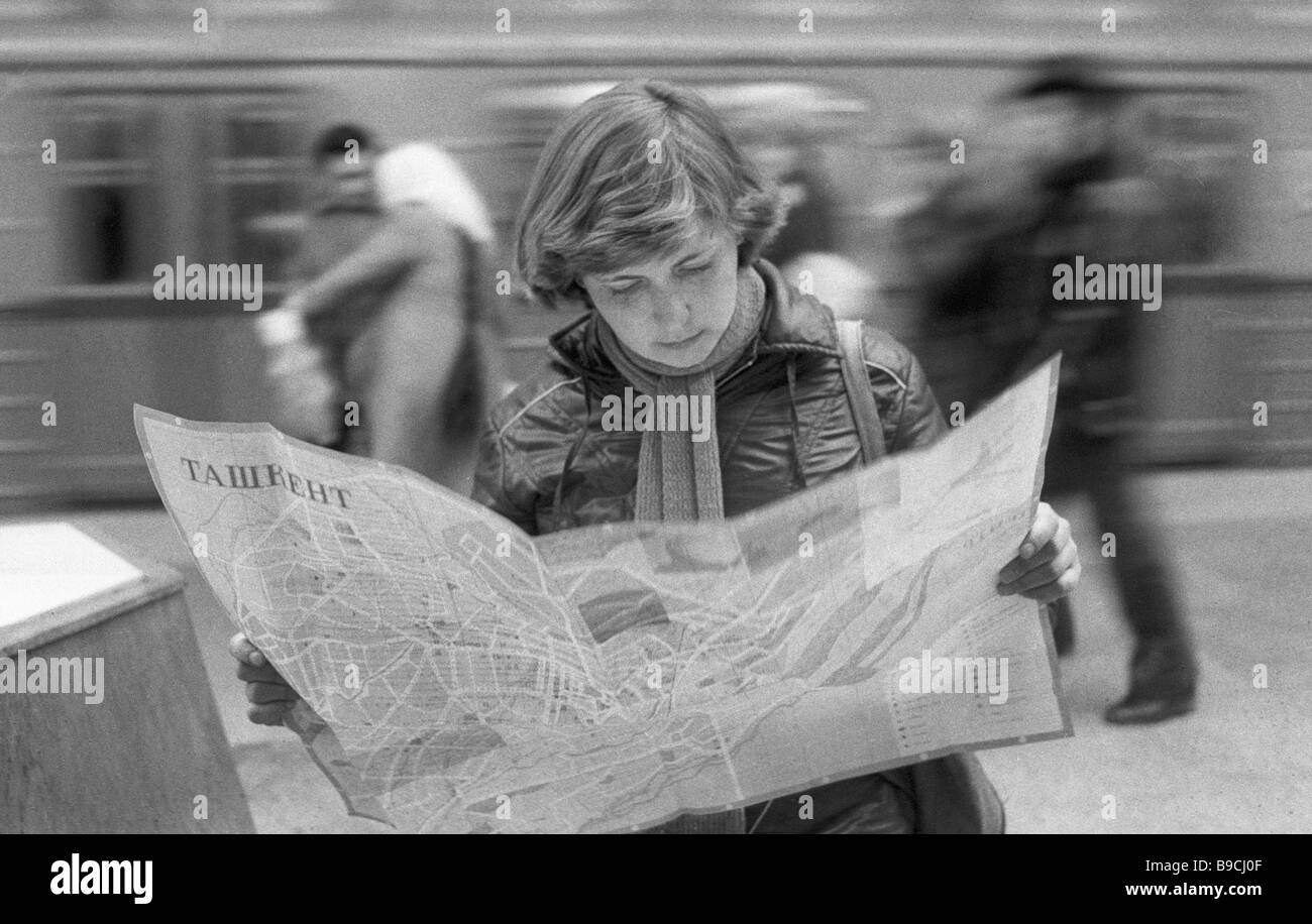 A girl chooses the shortest route on a Tashkent metro map Stock Photo ...