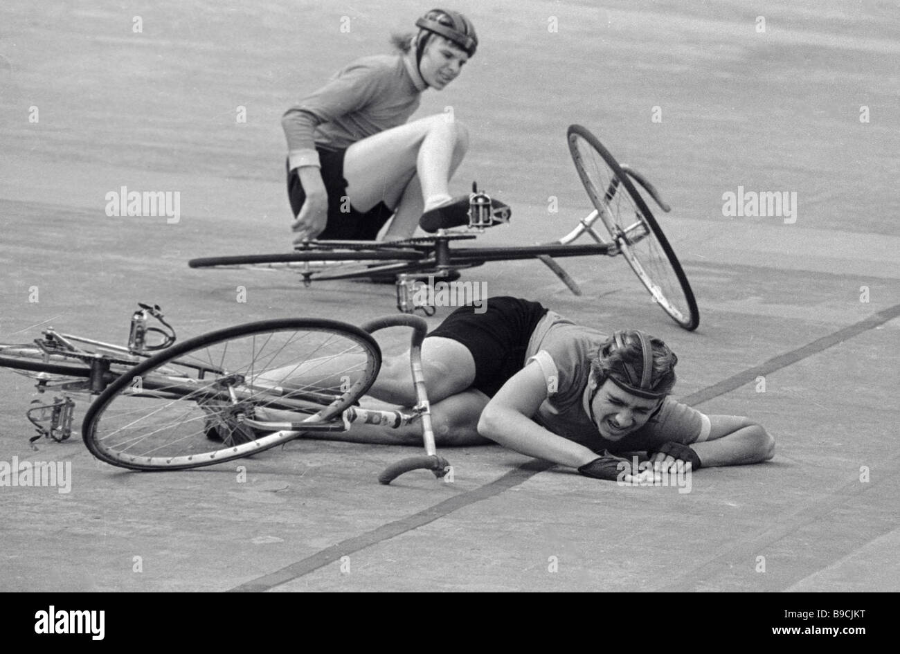 Cyclists after collision on the cycle track Stock Photo - Alamy