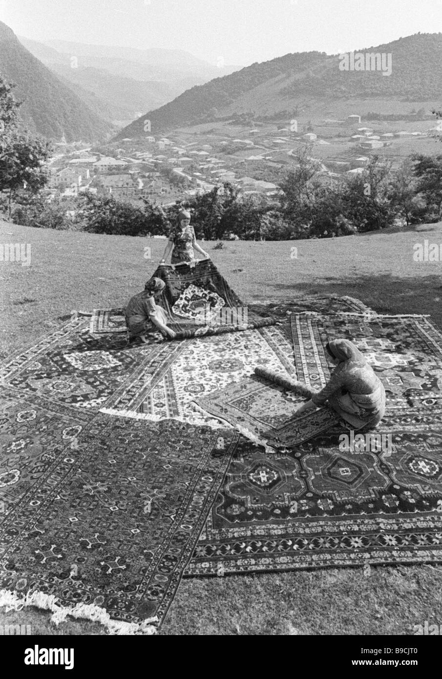 Weavers demonstrating the carpets of Tabasaransk manufacture Stock ...
