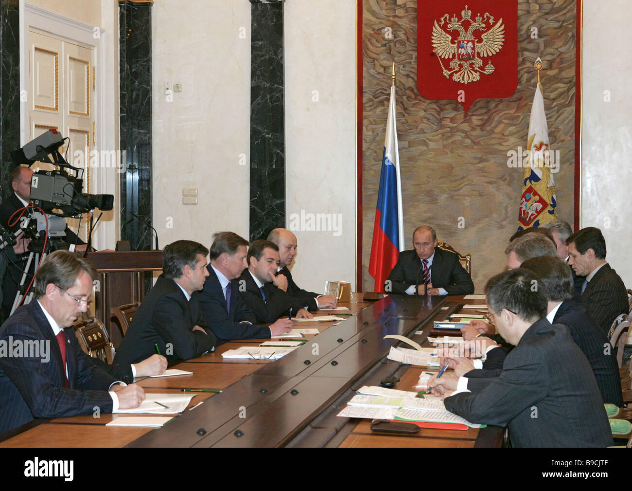 Russian President Vladimir Putin center chairing a Russian government ...