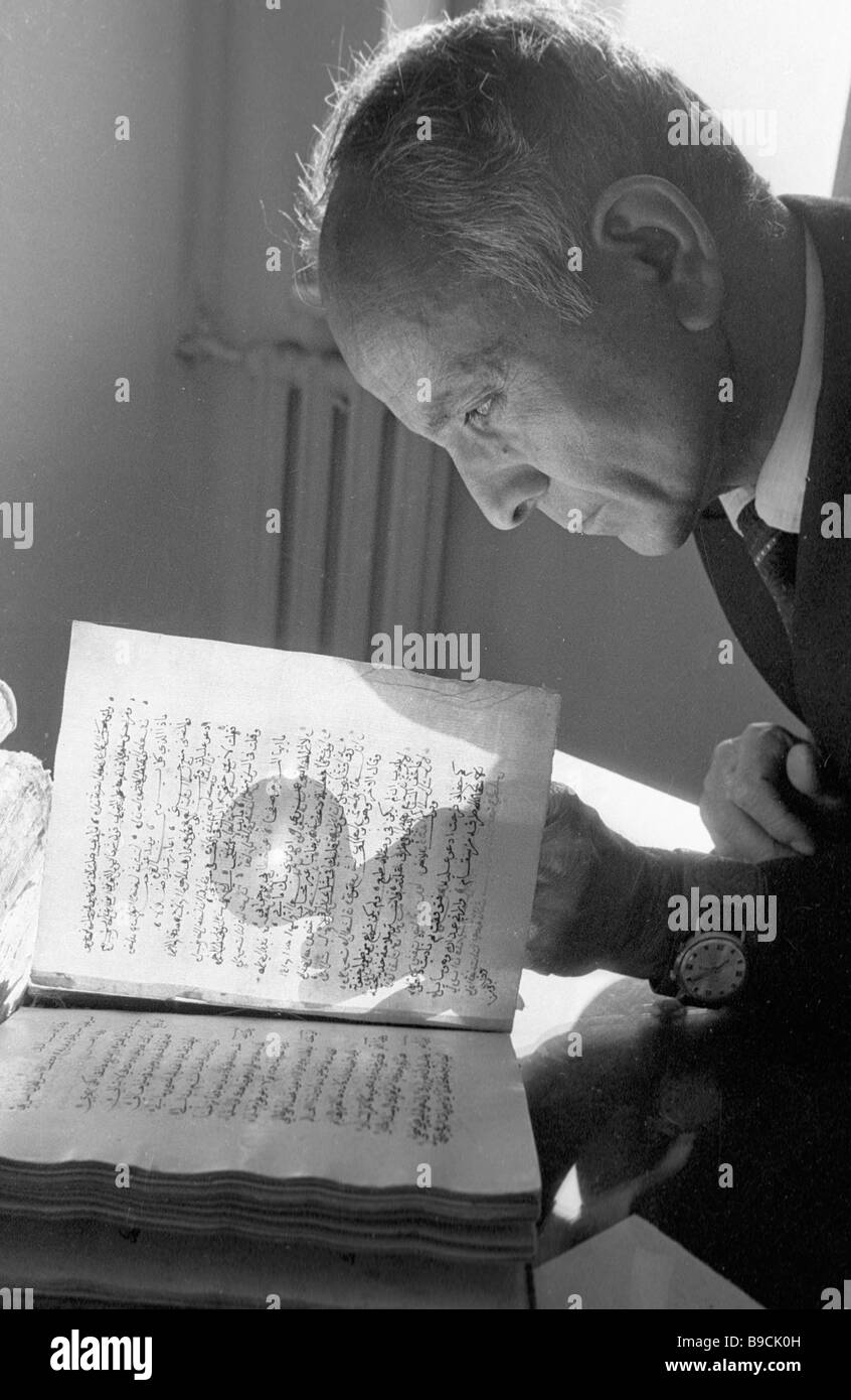 A Tajik Arabist studies an ancient Oriental manuscript Divan as sababa ...