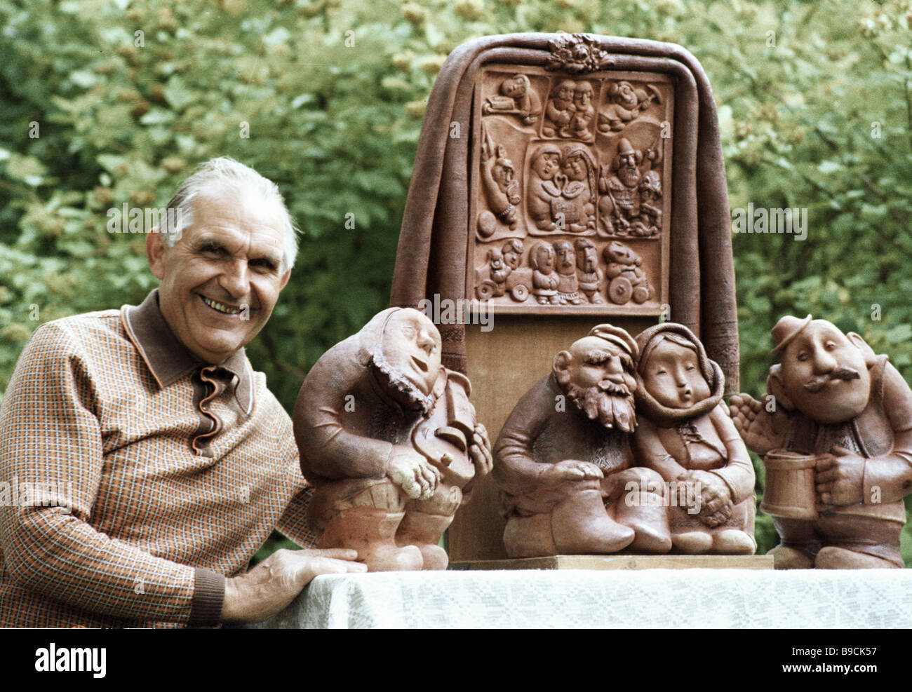 Sculptor Nikolai Pushkar demonstrating his works clay figurines of ...