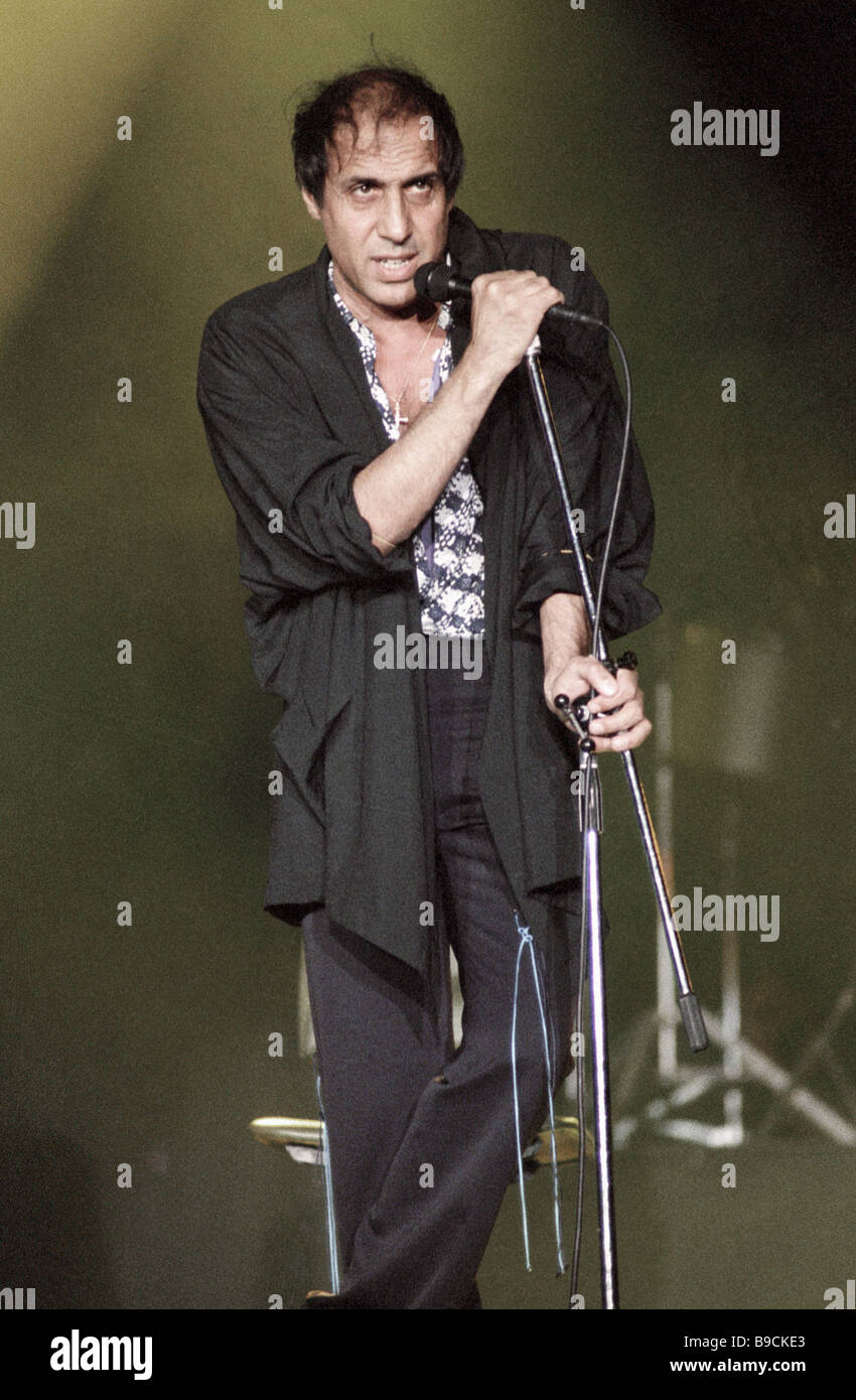 Italian singer and film actor Adriano Celentano singing on stage of ...