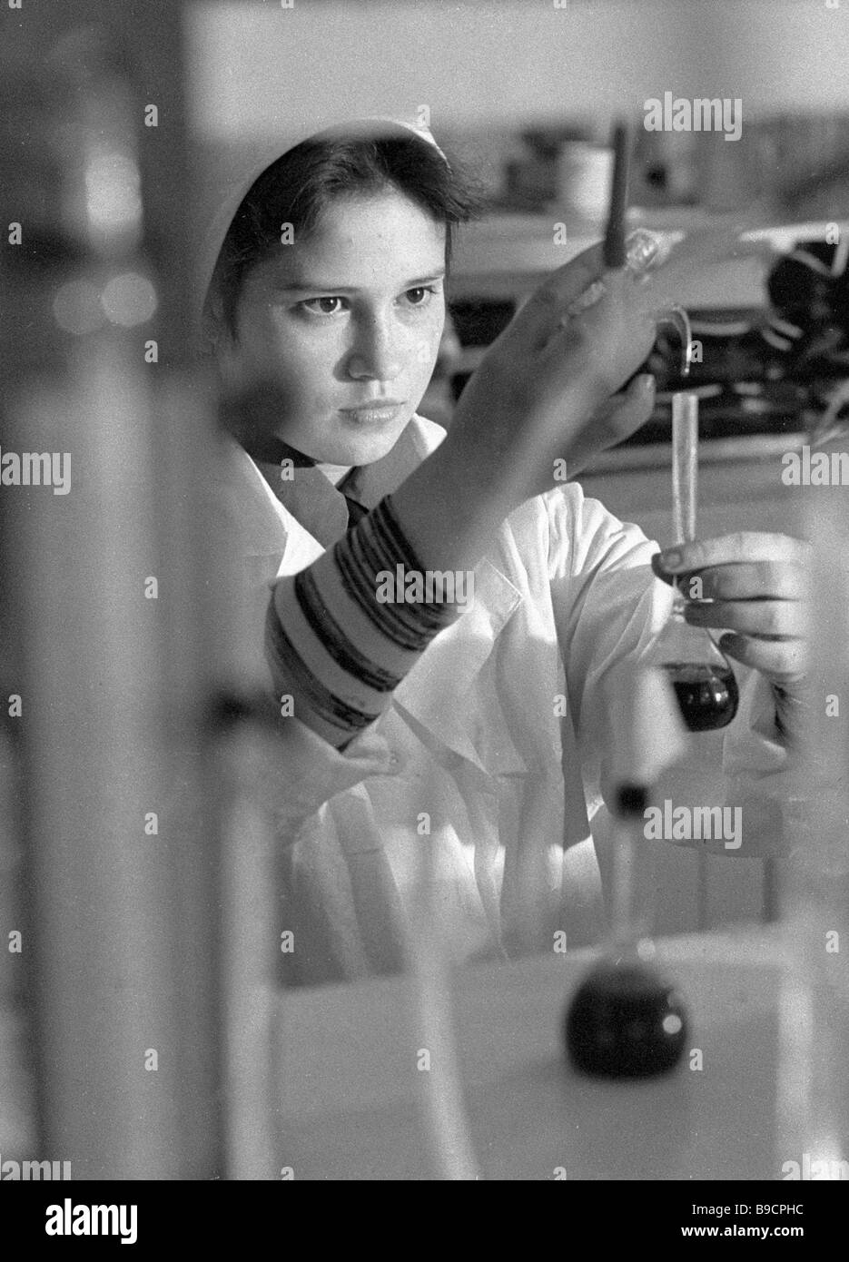 Lab assistant of a sugar mill checks the quality of product Stock Photo ...