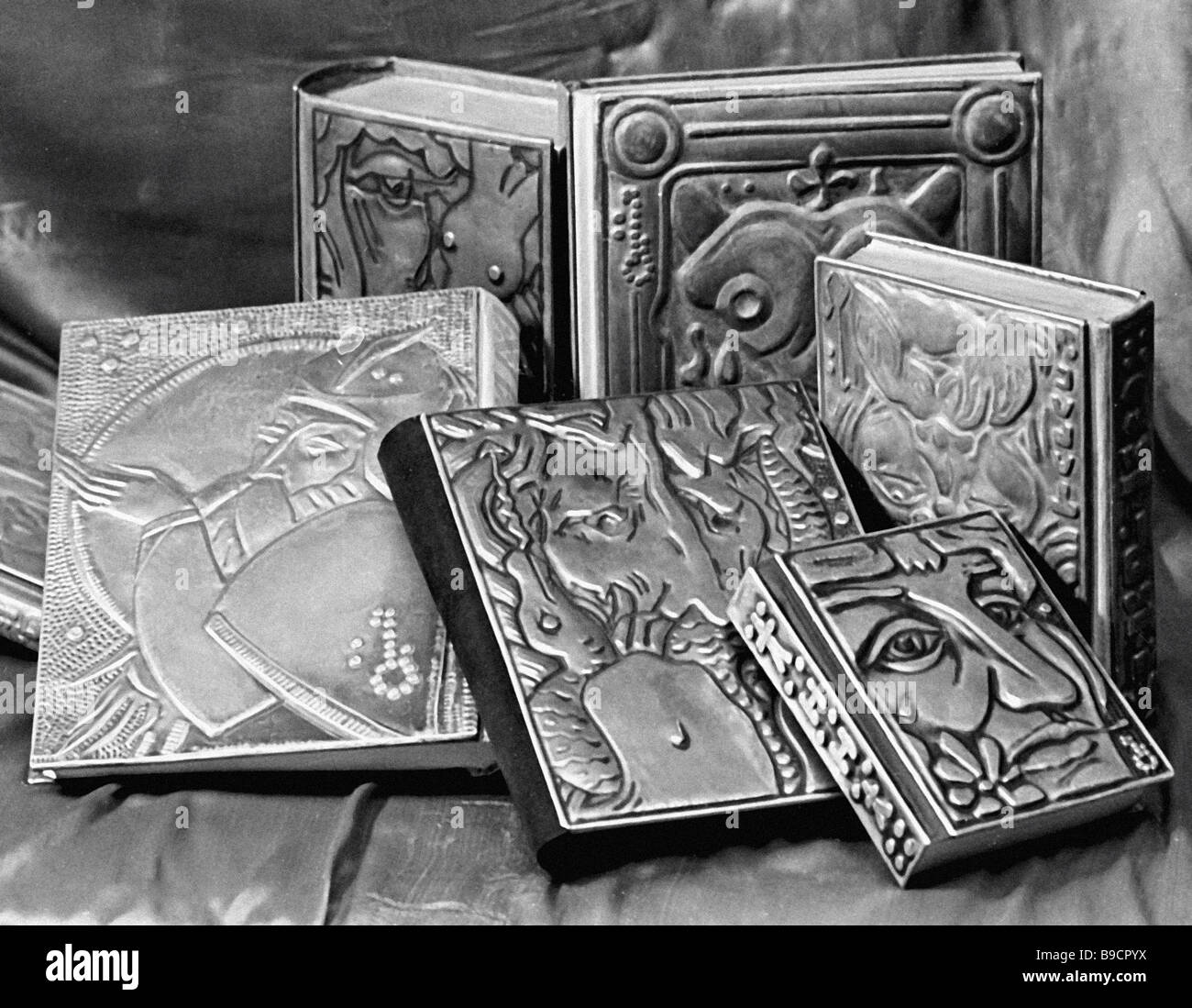 Metal book covers adorned with relief by artist Koba Guguruli Stock ...