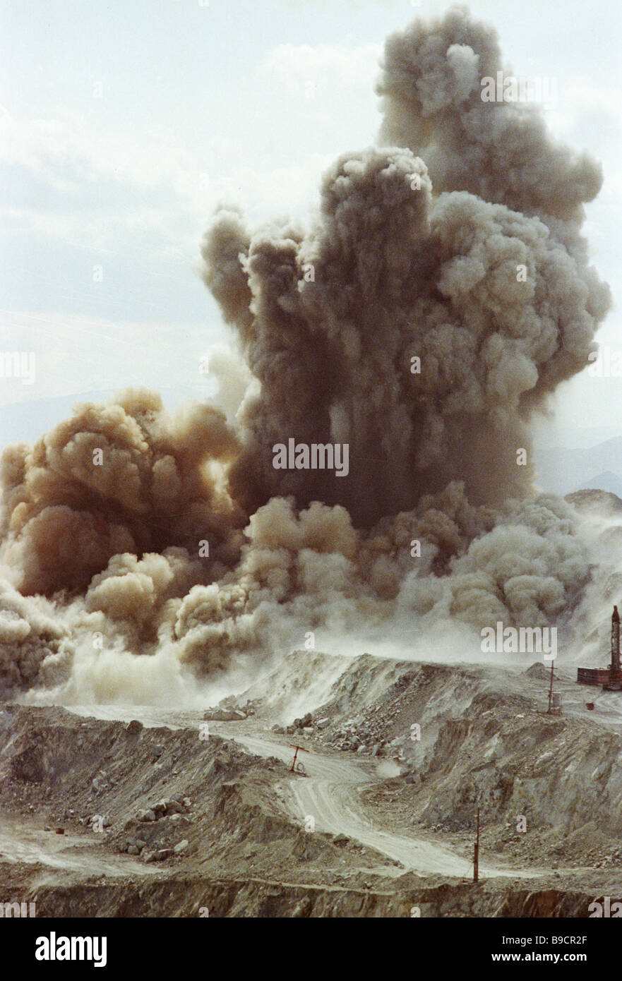 Blasting operations in the open pit mine of Tuvaasbest combine Stock ...