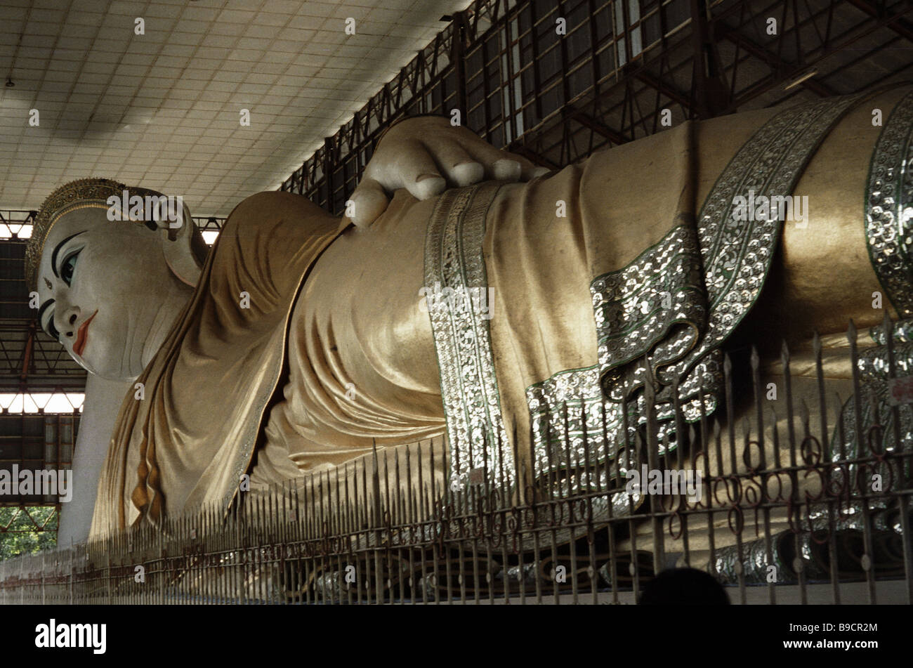 A Lying Buddha statue in a Rangoon pagoda Stock Photo - Alamy