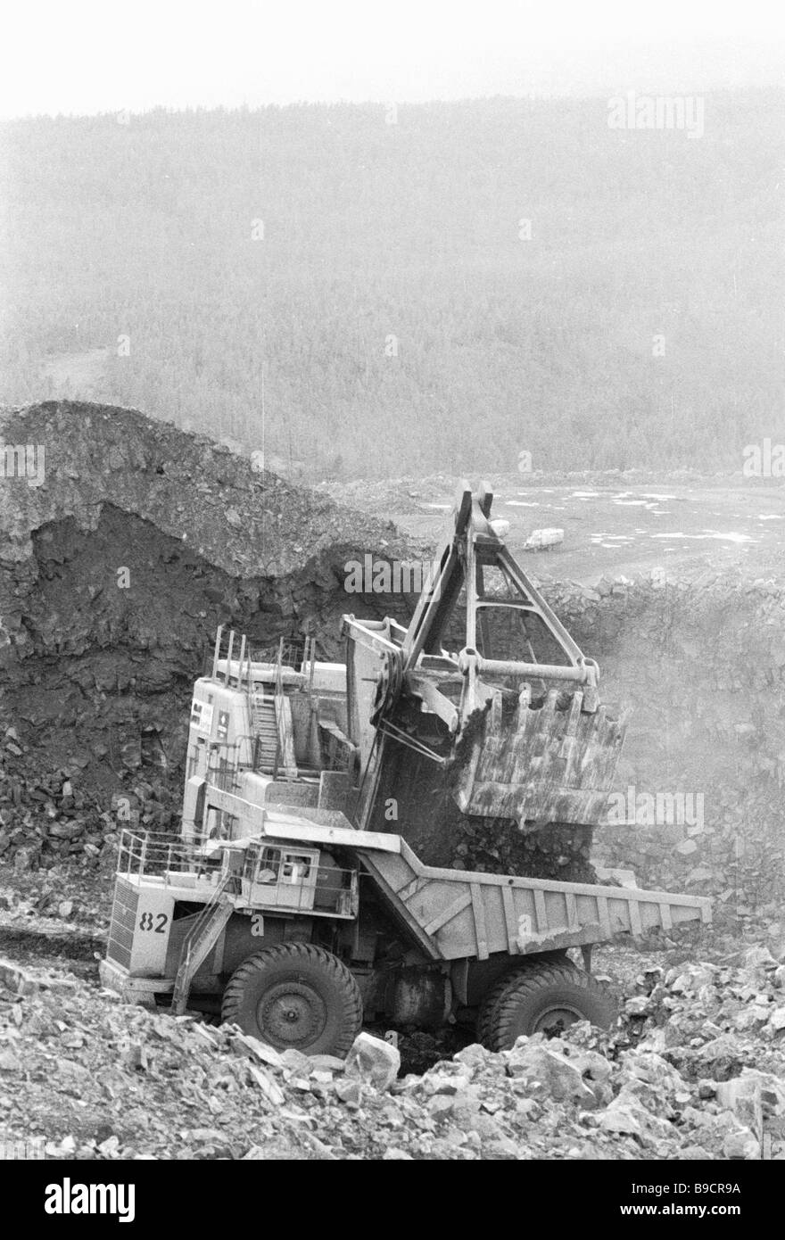 A coal excavator loading a Unit Rig dump truck Stock Photo - Alamy