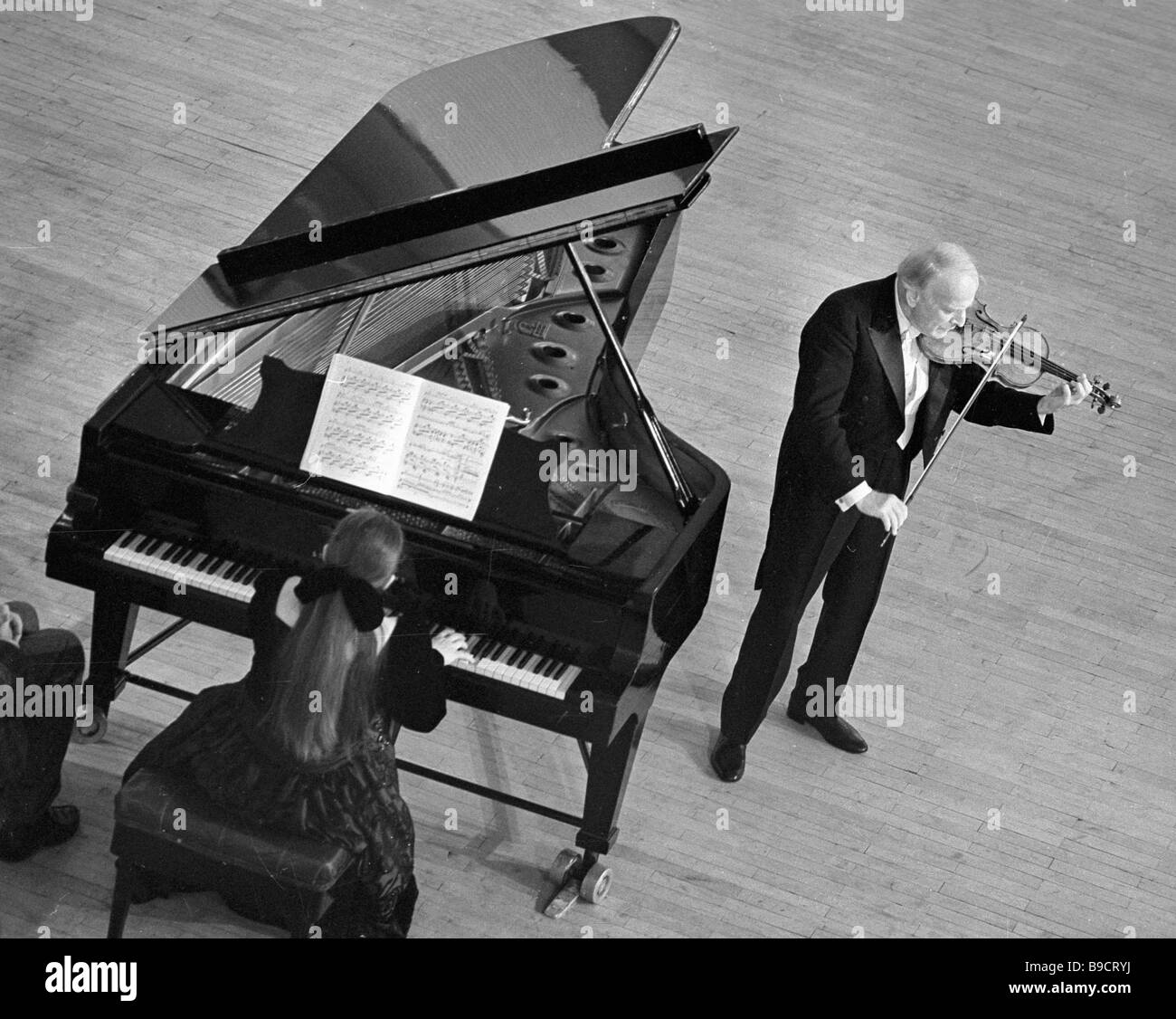 American violinist Yehudi Menuhin performs on stage of Tchaikovsky ...